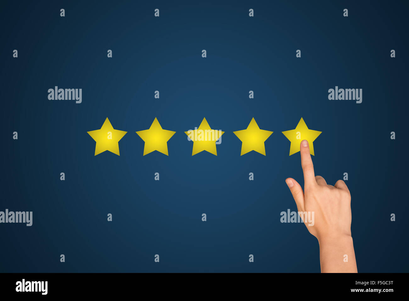 Womans hand pushing on star Stock Photo - Alamy