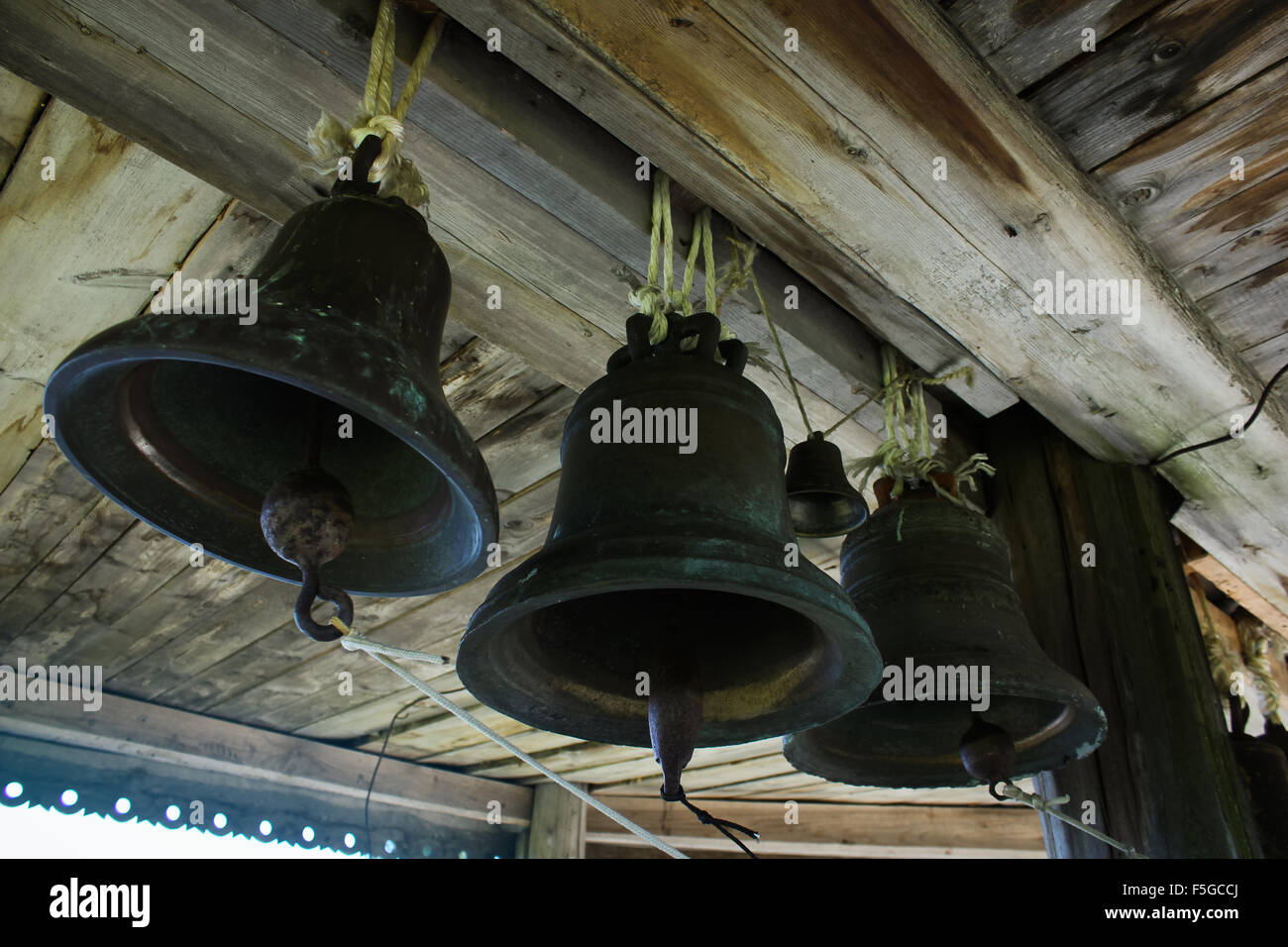 Four old bells in the belfry Stock Photo - Alamy