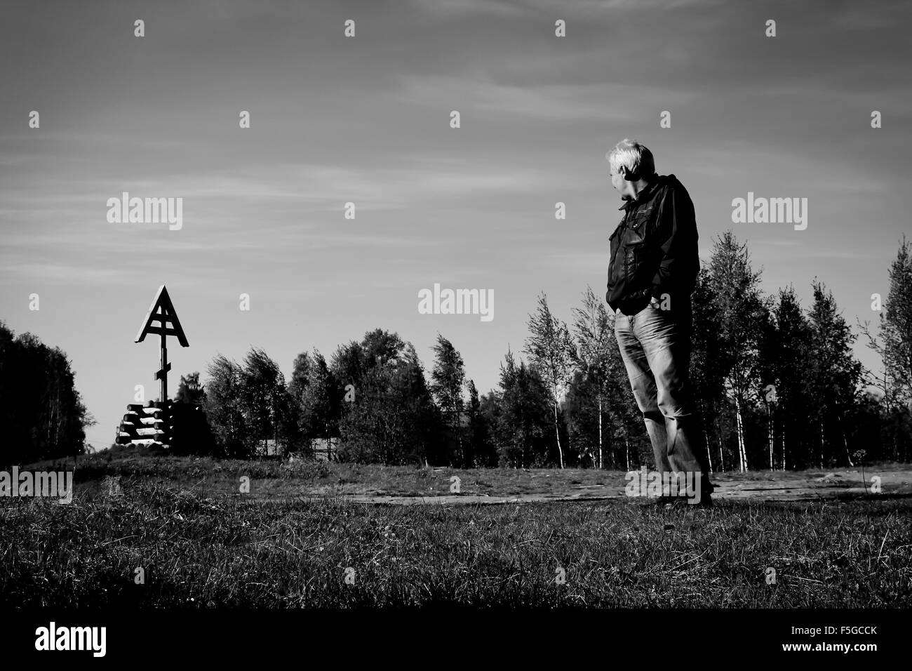 Old man looking at the cross Stock Photo - Alamy