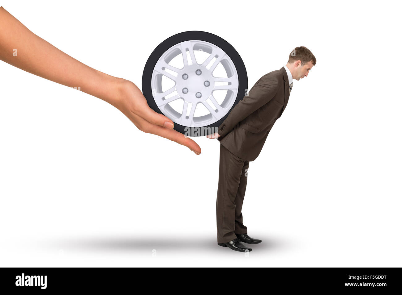 Hand giving car wheel to businessman Stock Photo - Alamy