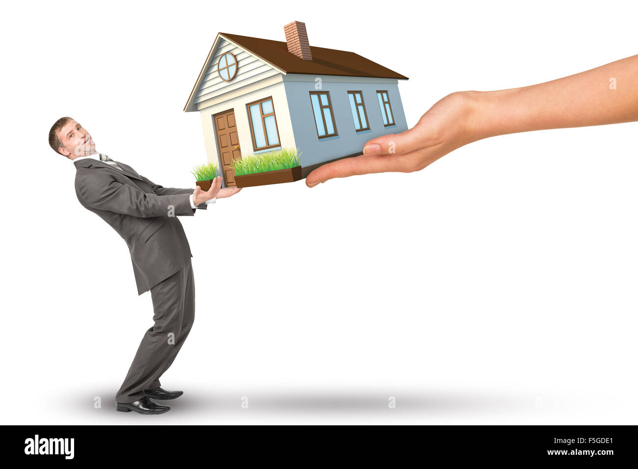 Hand giving brown house to businessman Stock Photo - Alamy