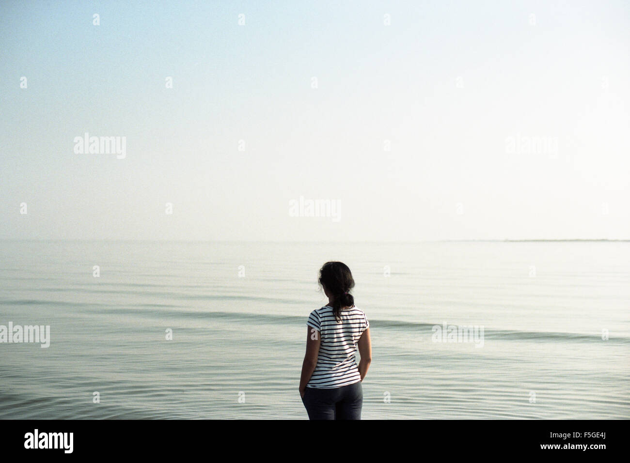 Woman watching the sea, Denmark Stock Photo - Alamy