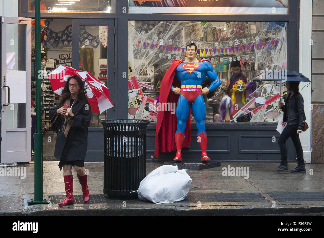 Los lane-a bespectacled young lady stands in front a superman statue on ...