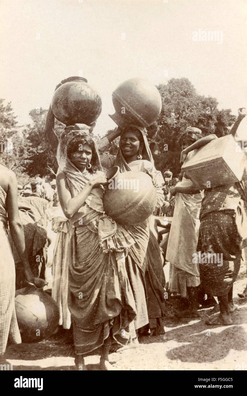 Carriers with packs on their heads , India Stock Photo - Alamy