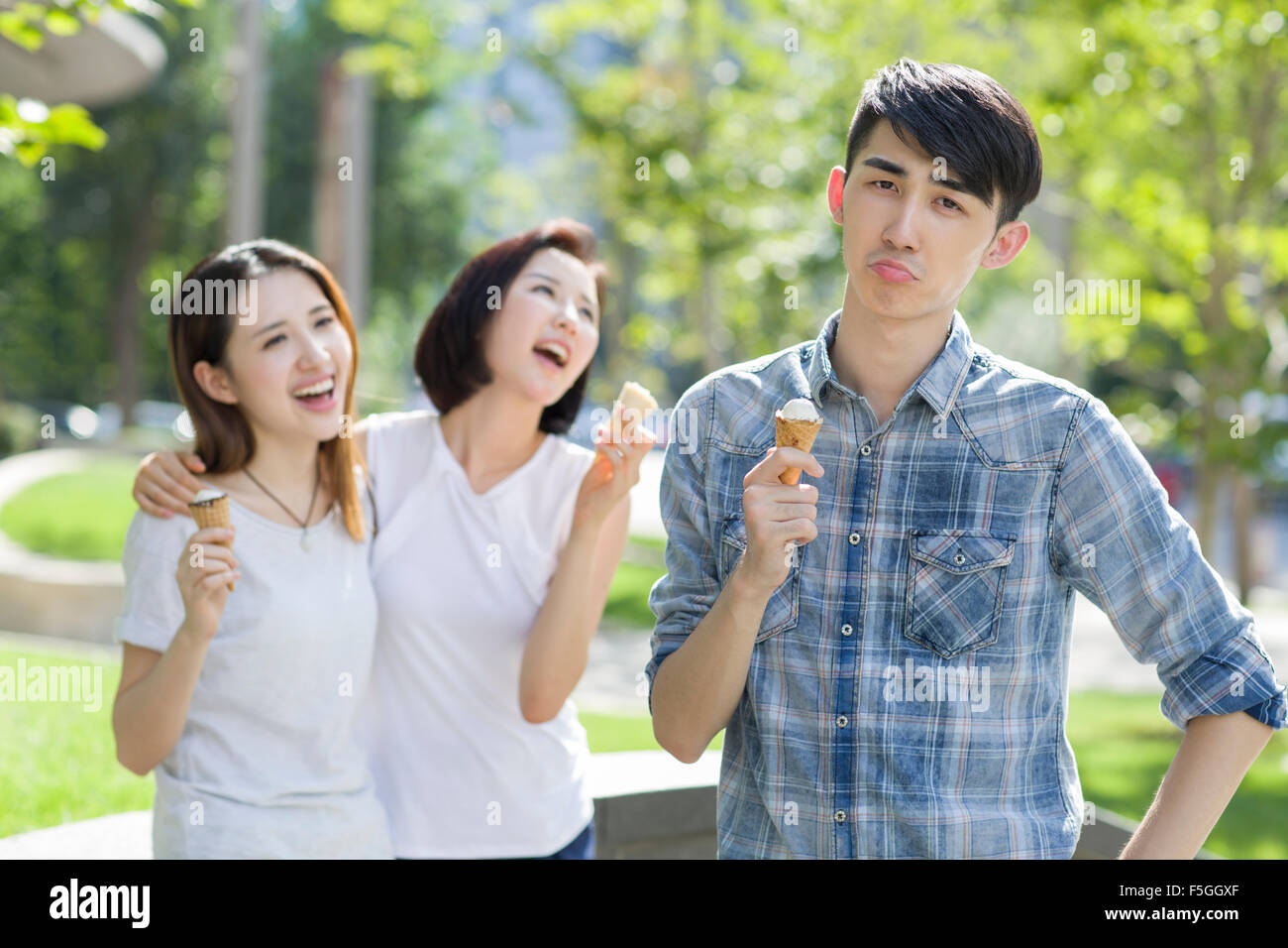 Indian men eating ice cream hi-res stock photography and images - Alamy