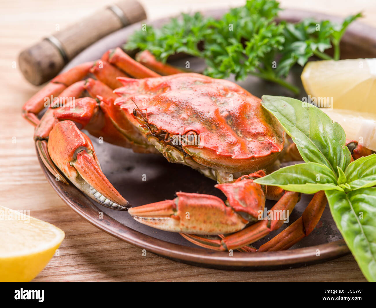Seafood dish - cooked crab with lemon and herbs Stock Photo - Alamy
