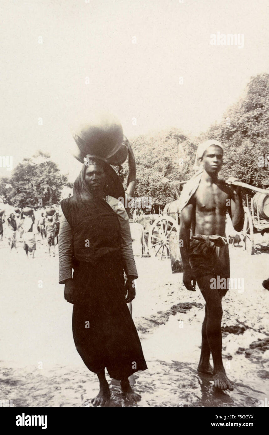 Bearer with pack on his head , India Stock Photo - Alamy