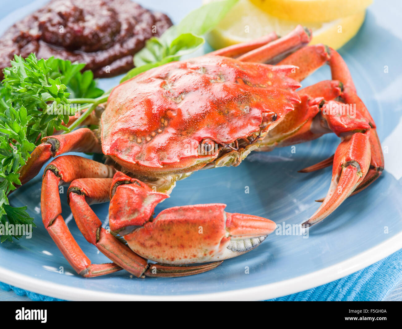 Seafood dish - cooked crab with lemon and herbs Stock Photo - Alamy