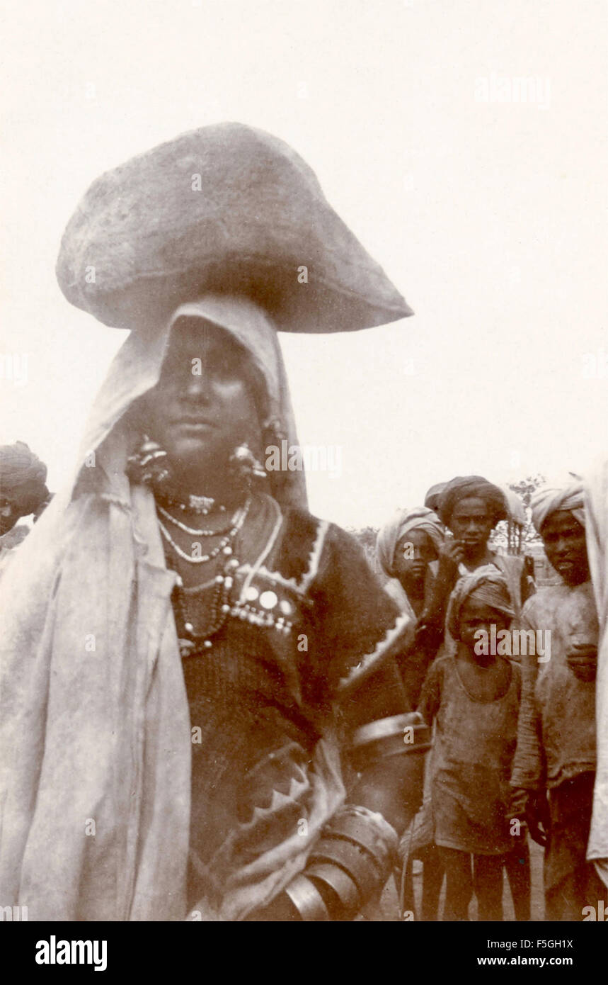 Bearer with pack on his head , India Stock Photo - Alamy