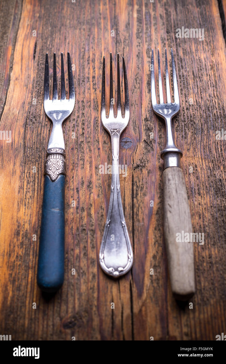 Vintage silverware on rustic wooden background Stock Photo - Alamy