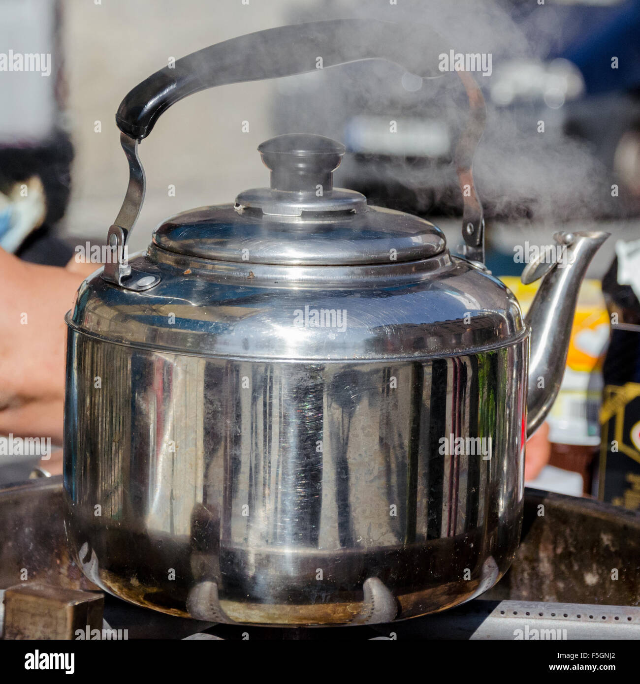 A hot metallic tea kettle Stock Photo - Alamy