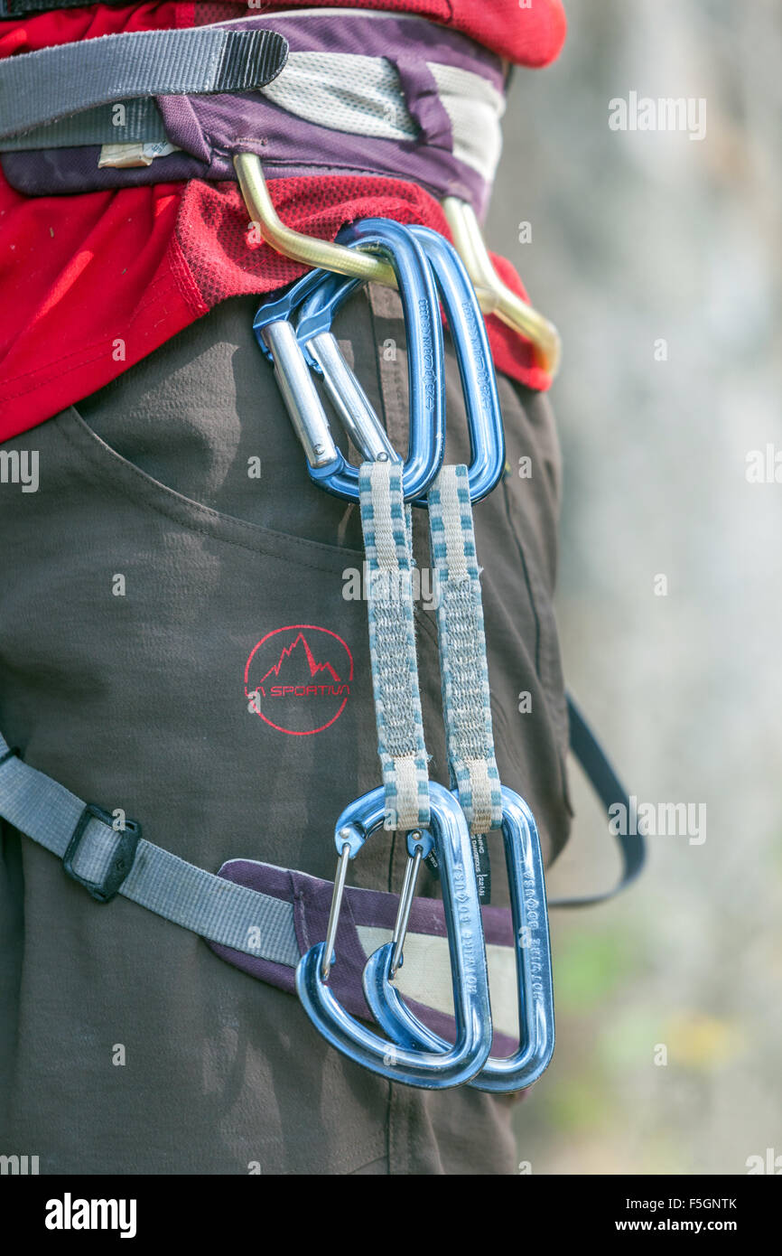 Climbing gear close up Man climber free climbing up the rock face, gear ...