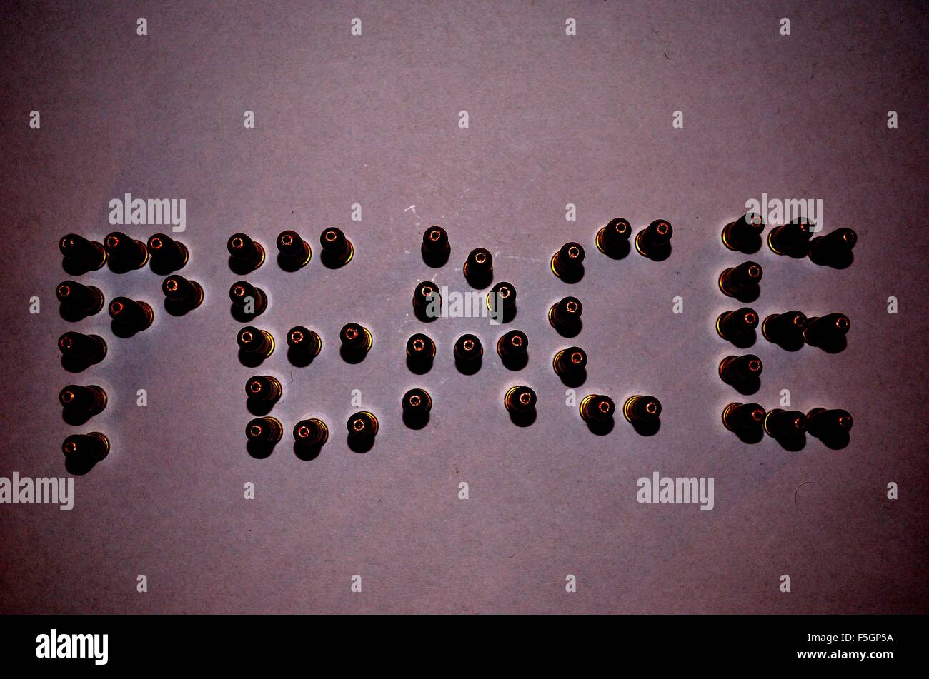 peace written with 22 caliber bullets ammunition Stock Photo - Alamy