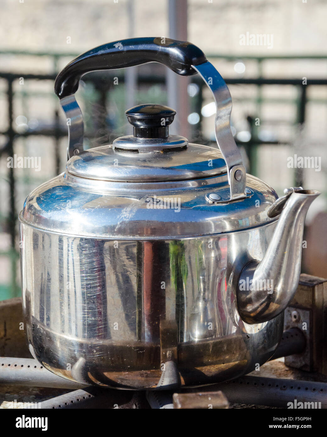 A hot metallic tea kettle Stock Photo - Alamy