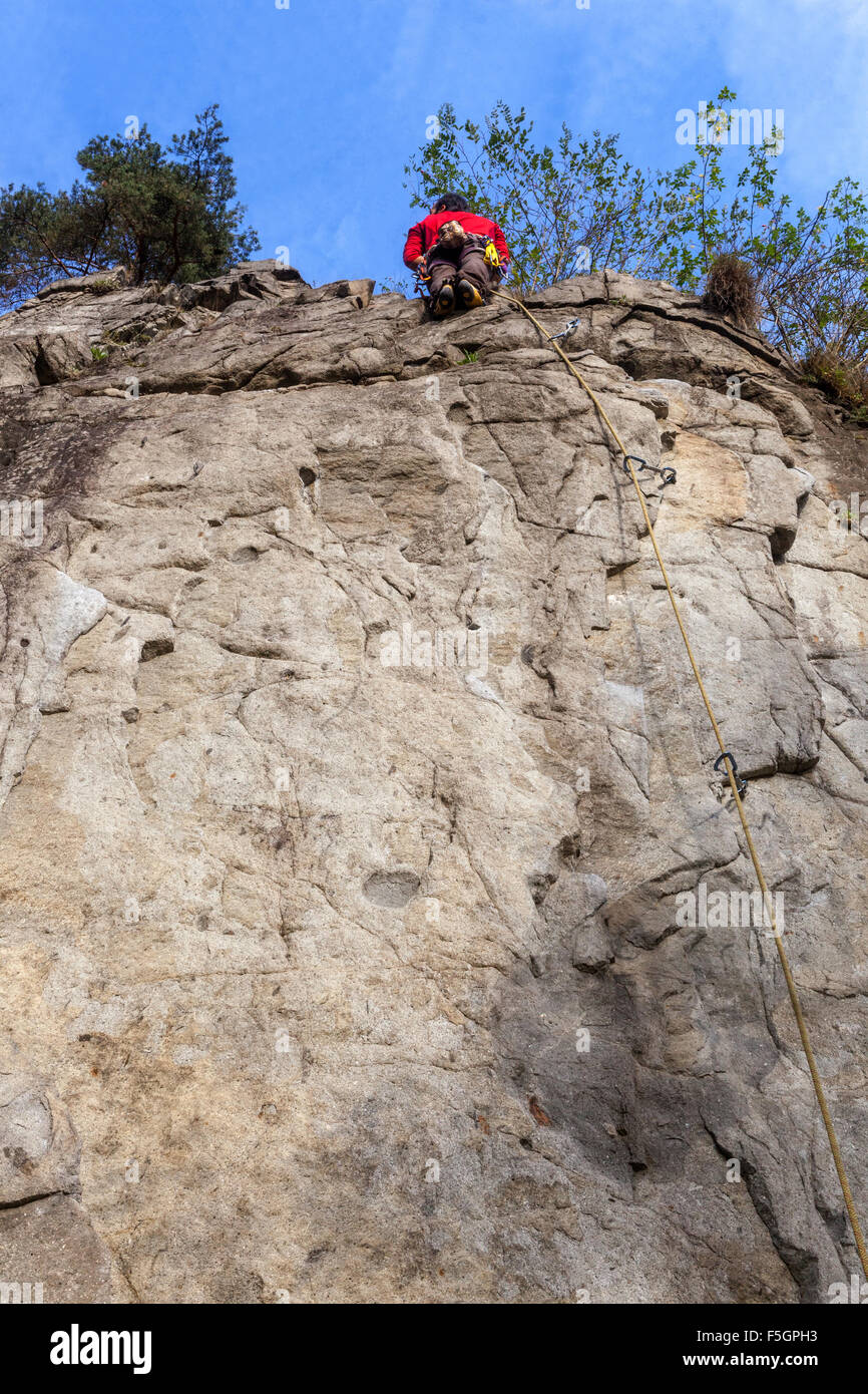 Man climber climbing up the rock face, Czech Republic Stock Photo - Alamy