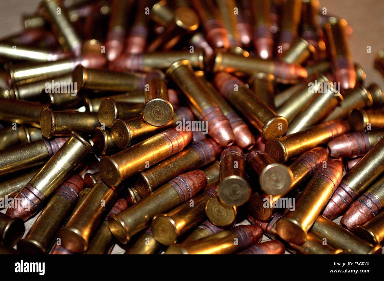 Big pile of 22 caliber ammunition in a pile macro photo Stock Photo - Alamy