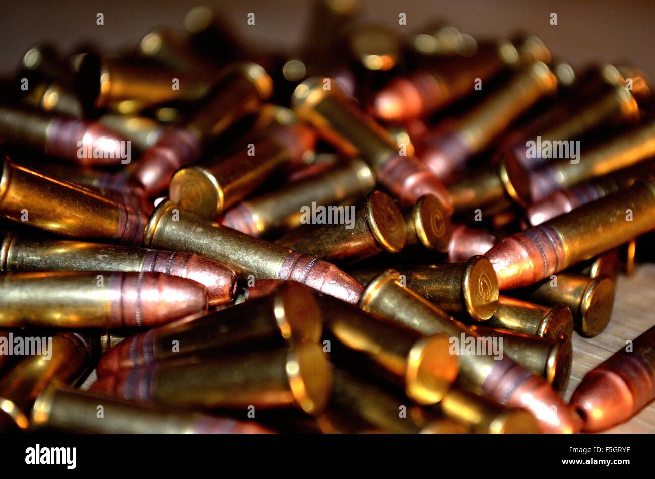 Big pile of 22 caliber ammunition in a pile macro photo Stock Photo - Alamy