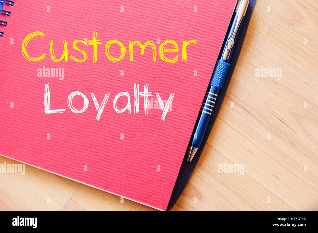Customer loyalty text concept write on notebook Stock Photo - Alamy