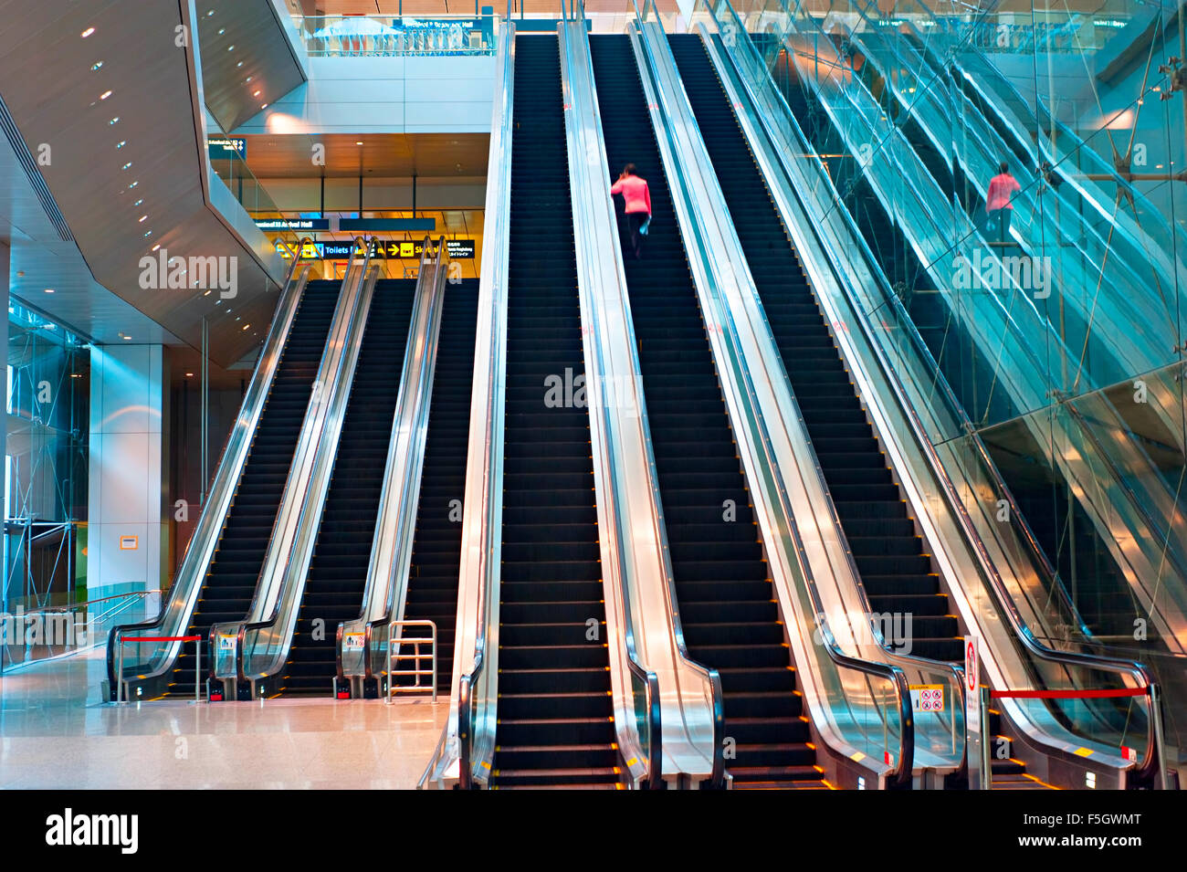 Escalator at Changi international airport in Singapore Stock Photo - Alamy