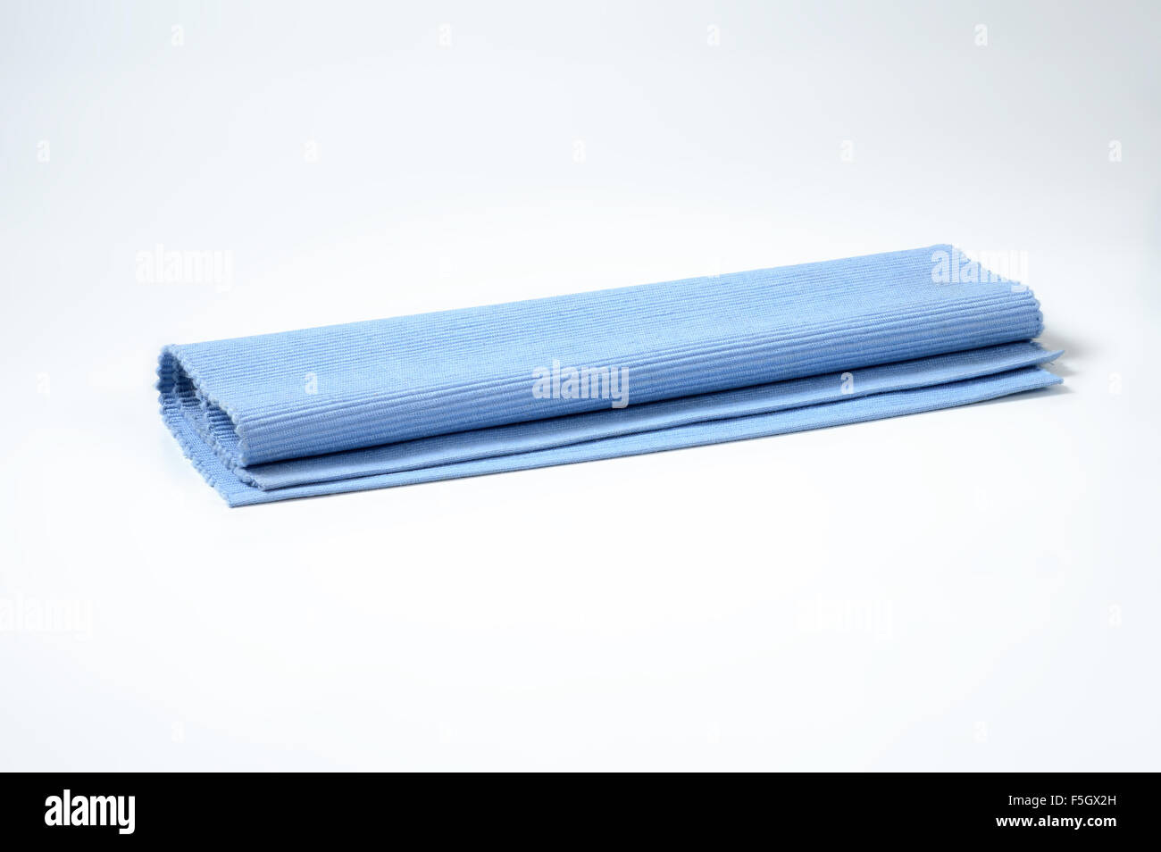 blue place mat on white background Stock Photo - Alamy