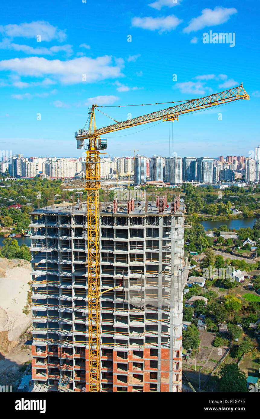 Aerial view of construction site with crane and workers in progress ...