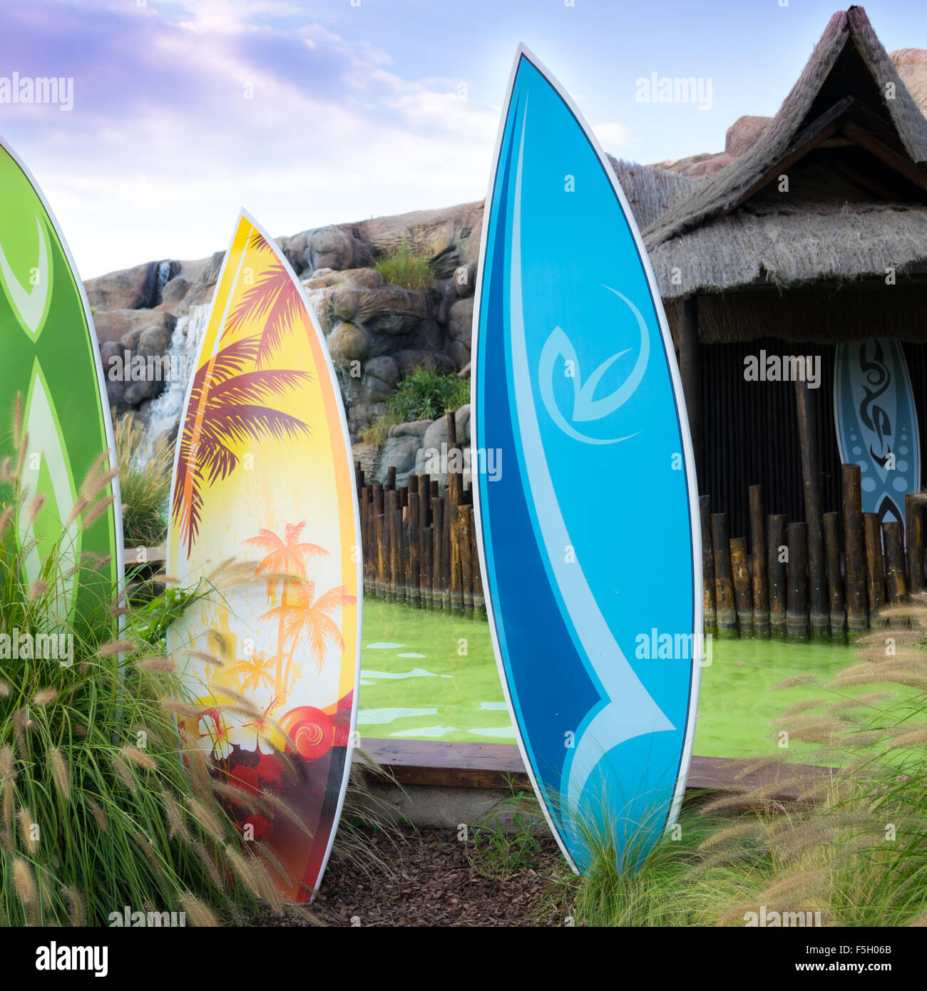 Colorful surfboards in front of a typical Hawaiian hut Stock Photo - Alamy