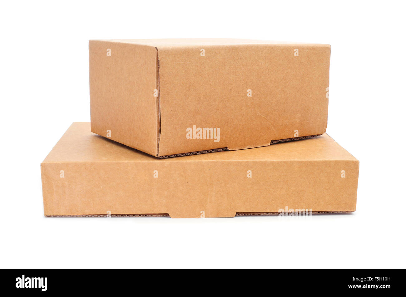 some cardboard boxes of different sizes on a white background Stock ...
