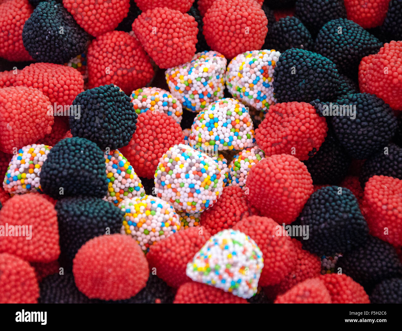 Fruits candies red, black and colorful close-up Stock Photo - Alamy