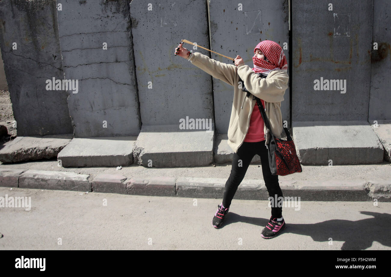 Ramallah, West Bank. 7th Mar, 2015. A Palestinian woman launches stones ...