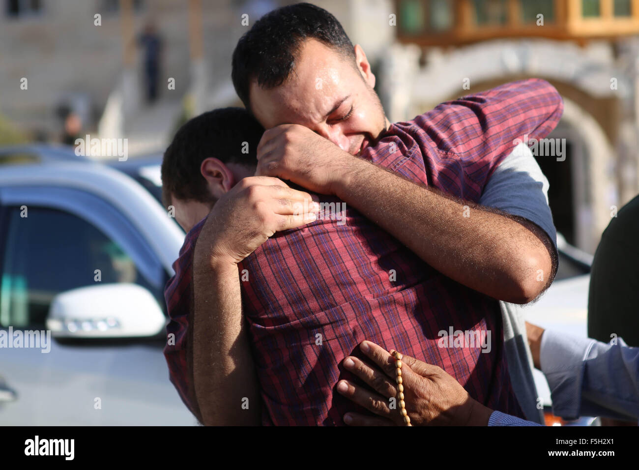 Ramallah, West Bank. 10th Aug, 2015. Relatives mourn during the funeral ...