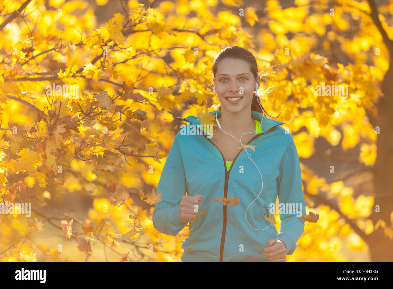 Female fitness model training outside and running Stock Photo - Alamy