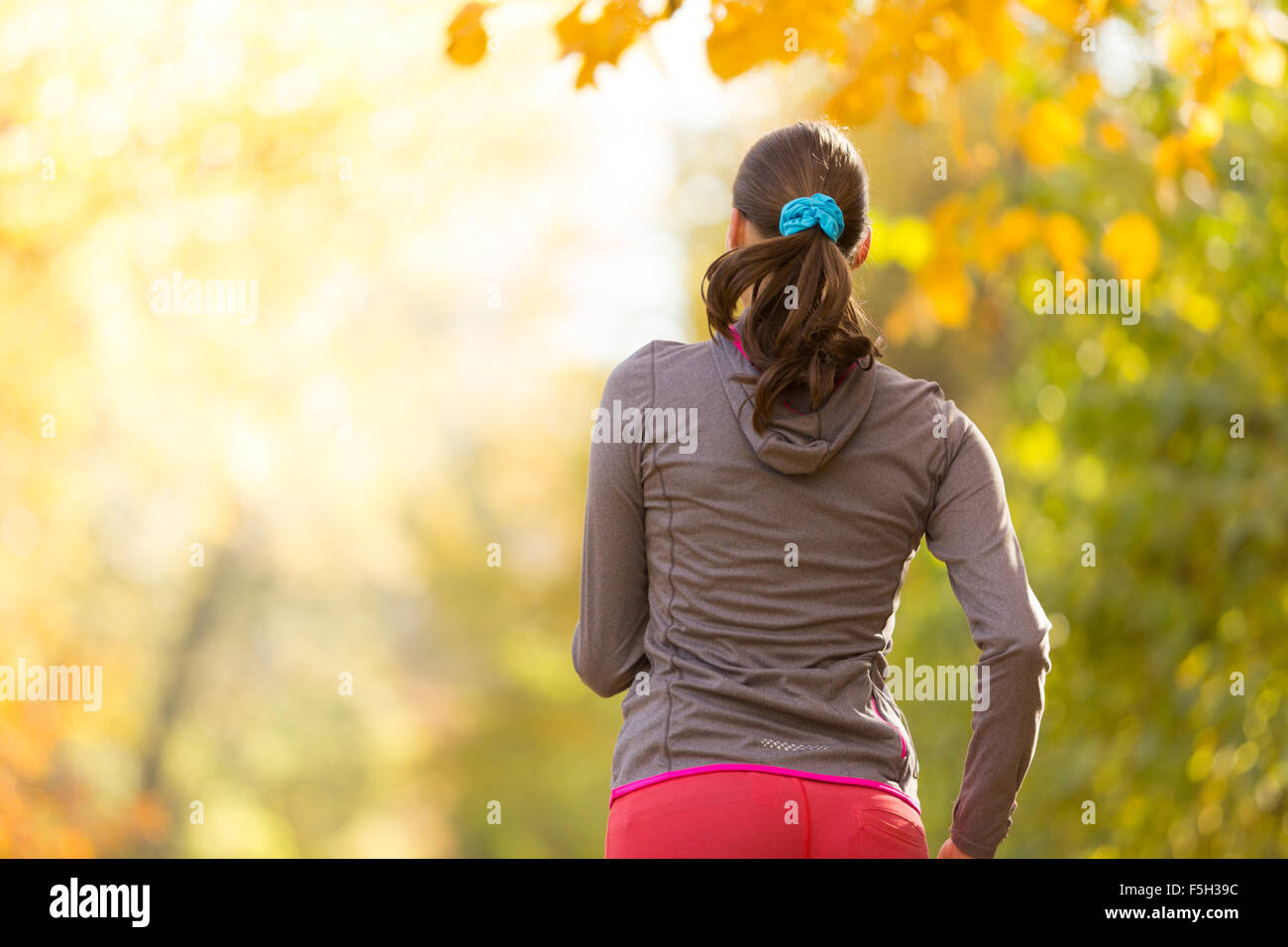 Female fitness model training outside and running Stock Photo - Alamy