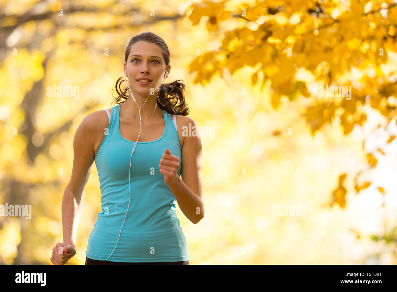 Female fitness model training outside and running Stock Photo - Alamy