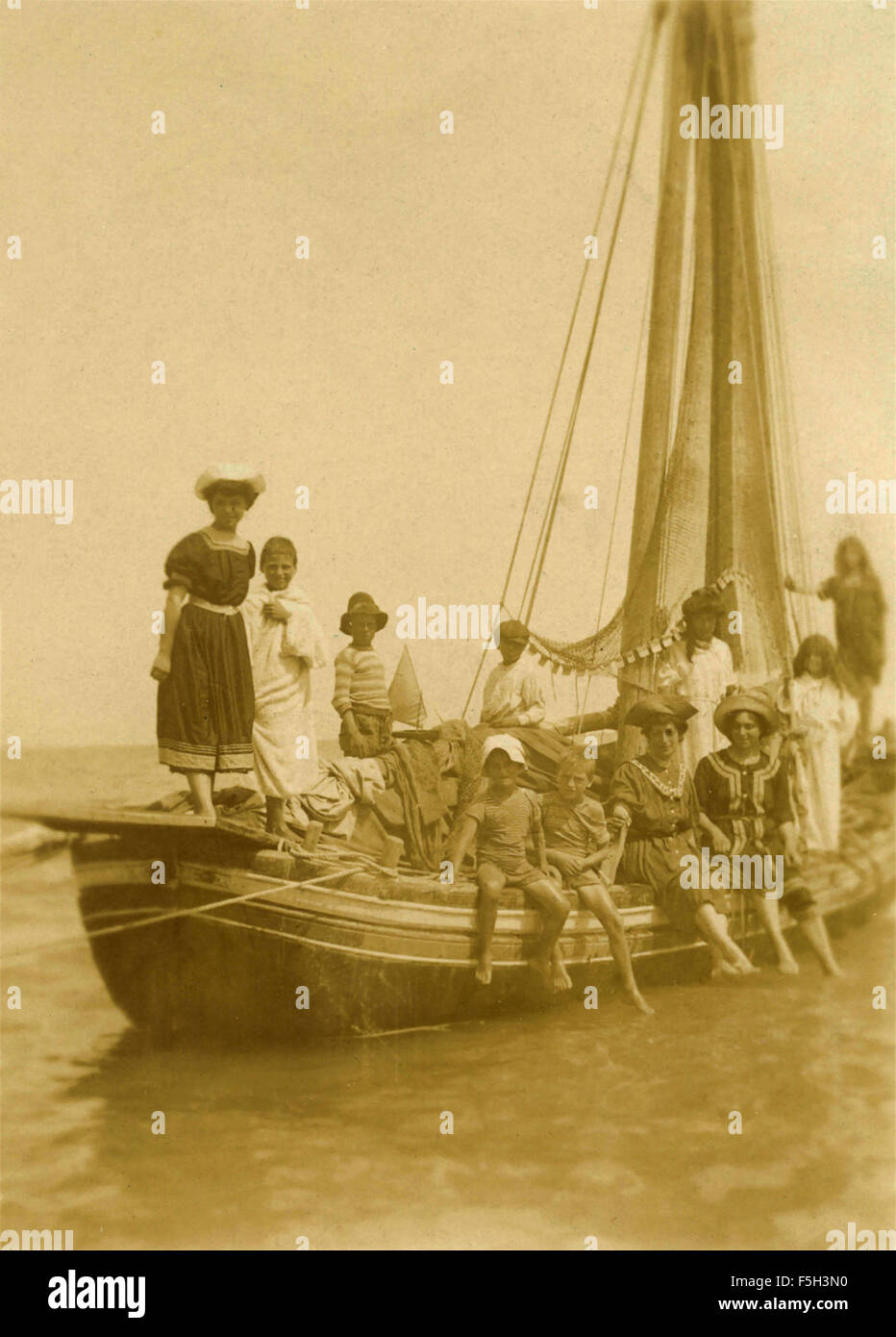 Large group on a boat, Italy Stock Photo - Alamy