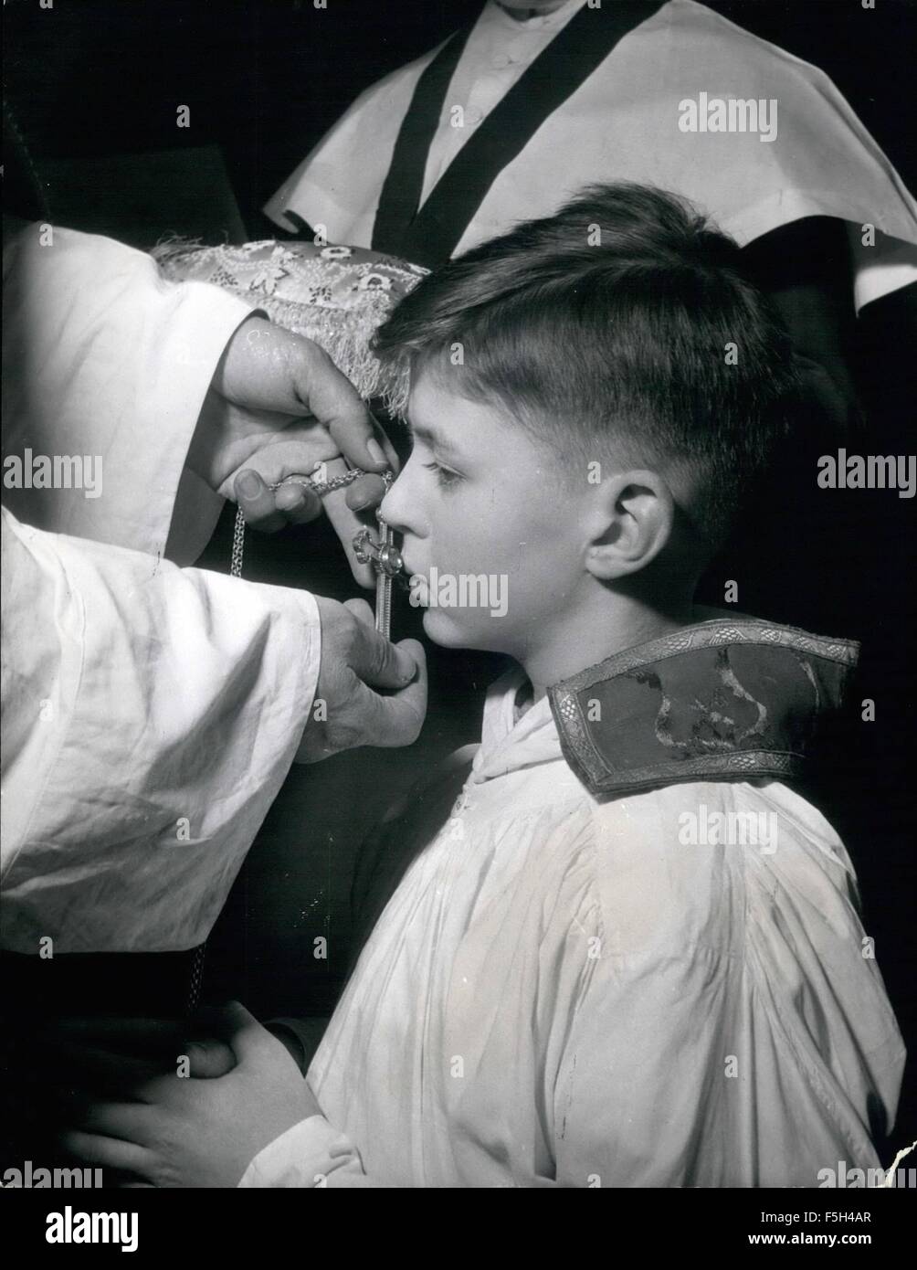 1962 - A Boy Bishop Is Made: Timothy Owen-Burke kisses the cross held ...