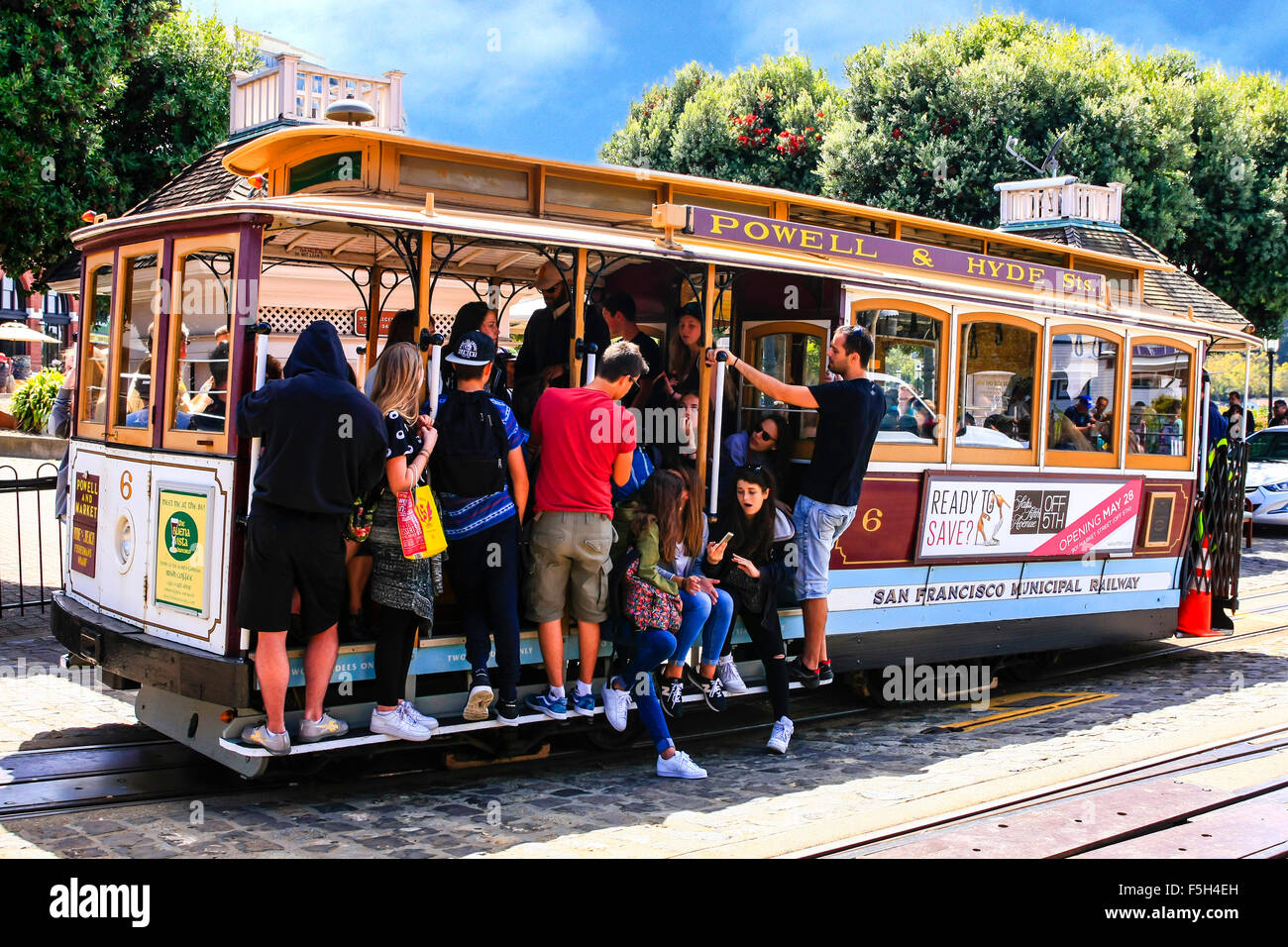 People riding the famous San Francisco cable cars, the last manually ...