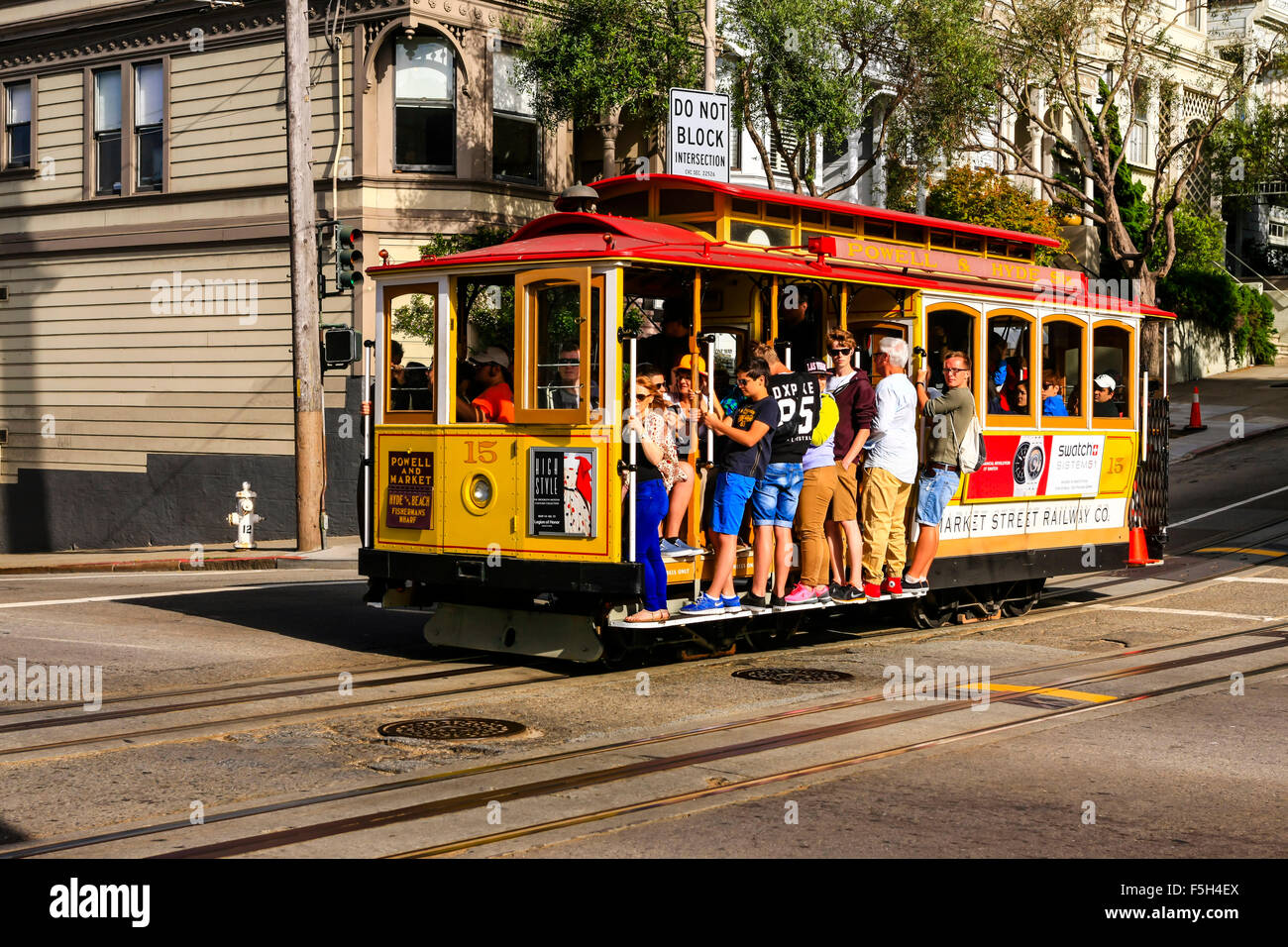 People riding the famous San Francisco cable cars, the last manually ...