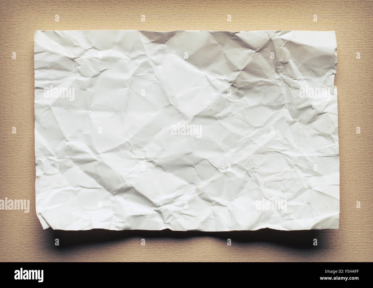 Crumpled white paper card on beige background, place for text Stock ...