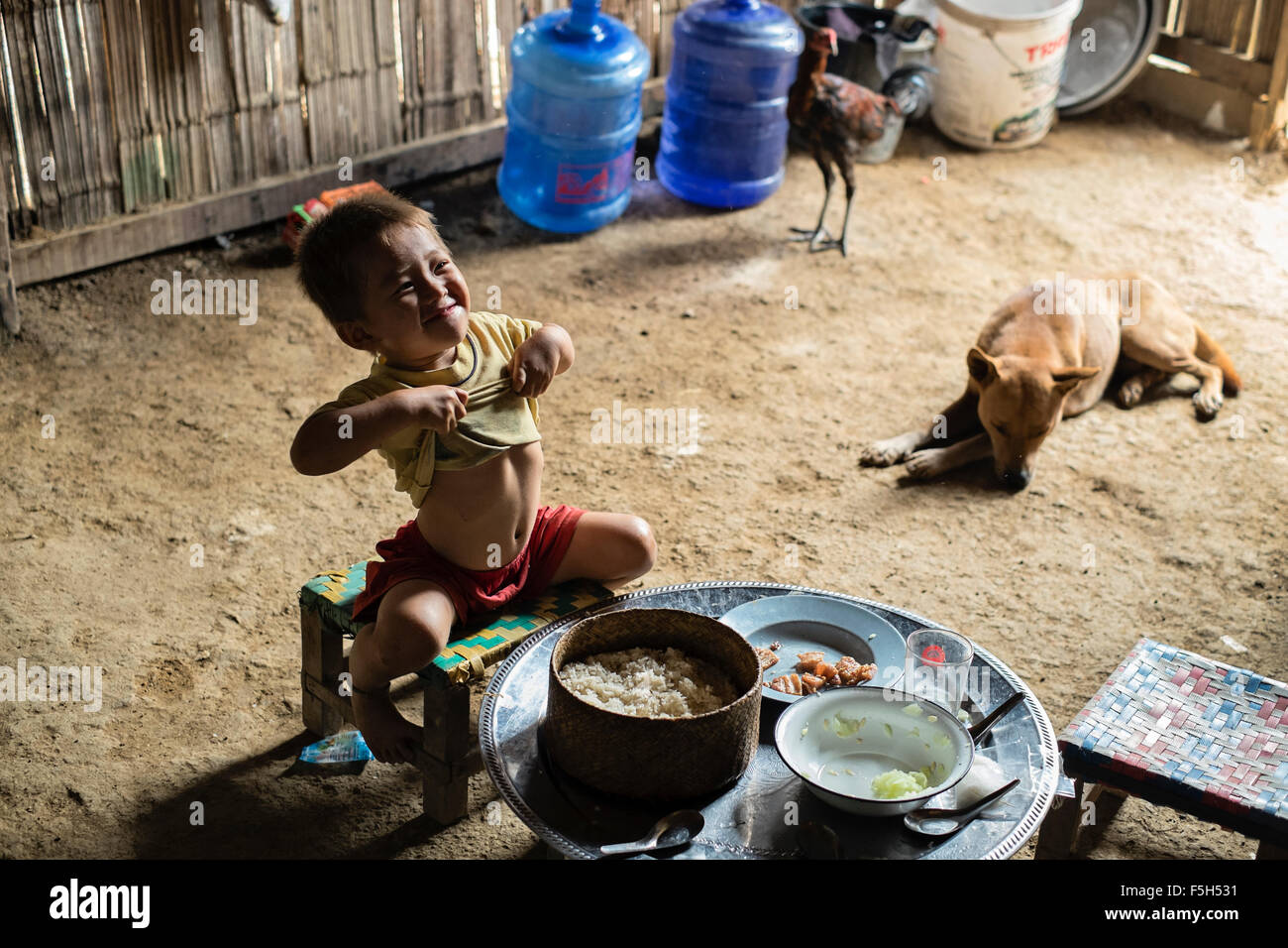 Child eating rice ground hi-res stock photography and images - Alamy