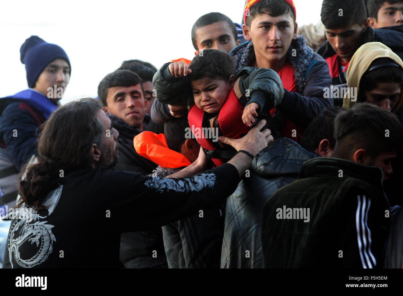 Athens. 4th Nov, 2015. A group of Syrian and Afghan refugees arrive at ...