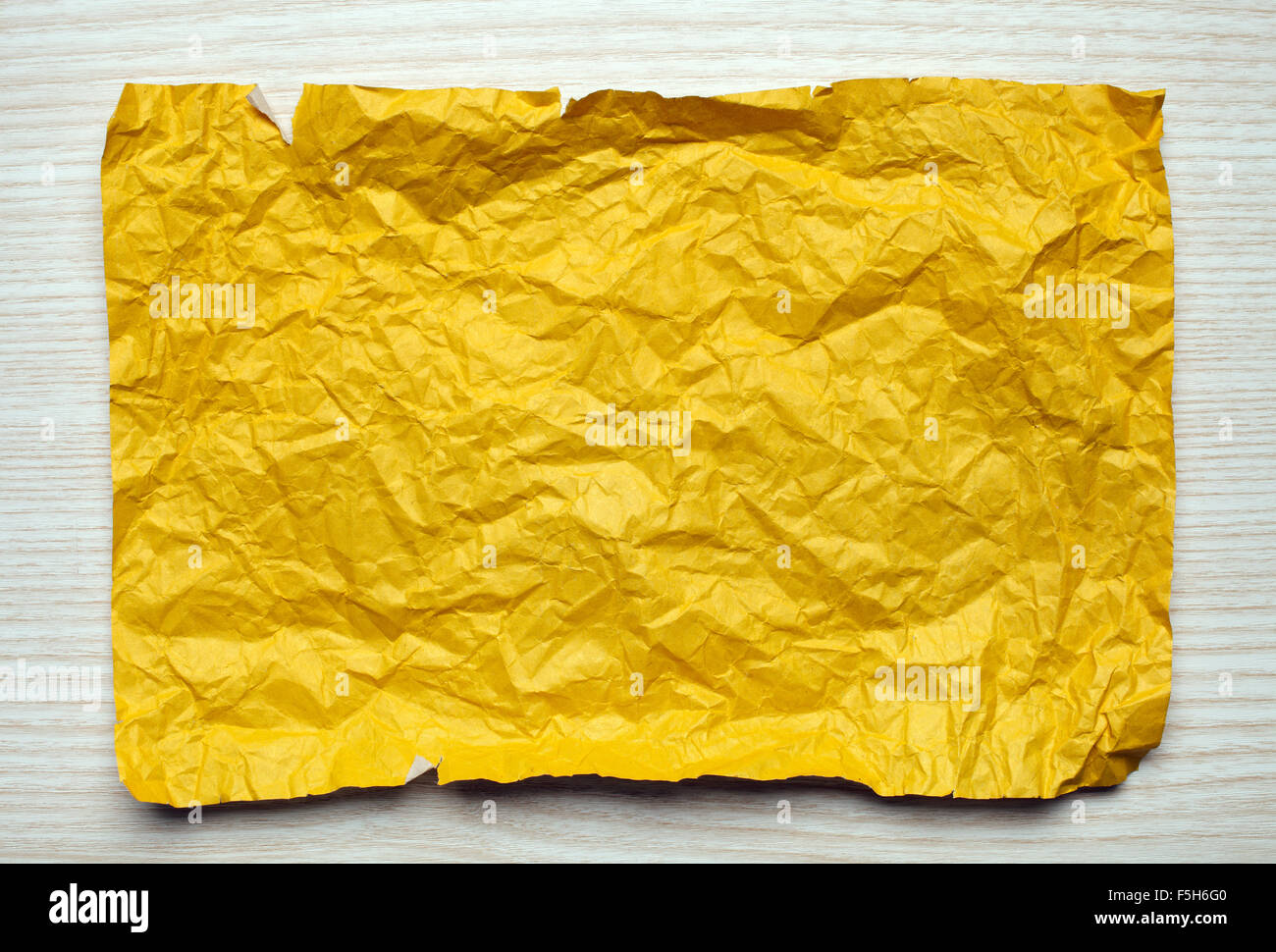 yellow Crumpled paper card Stock Photo - Alamy