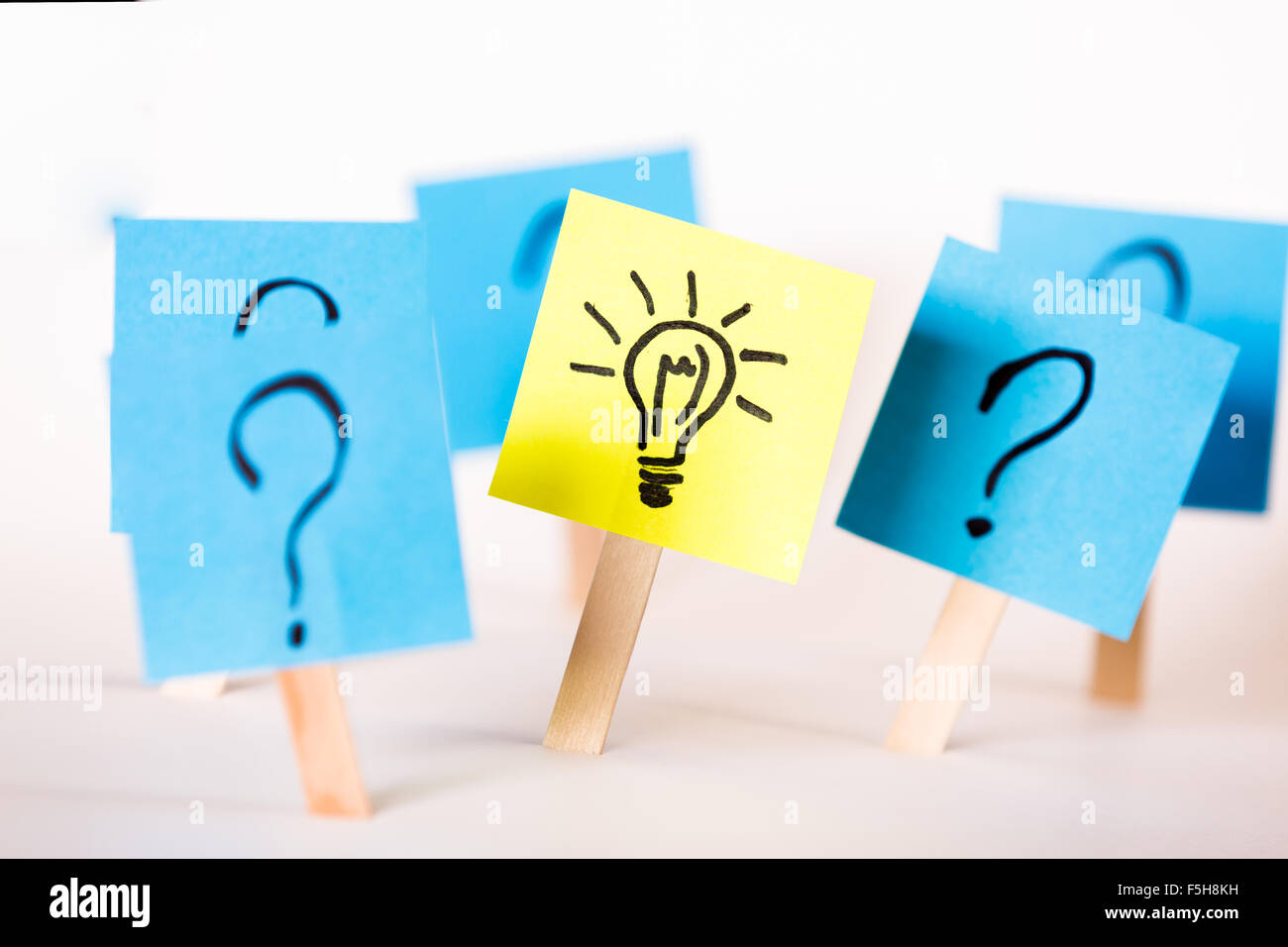 conceptual image for a good idea hand drawn on a sticky note with ...