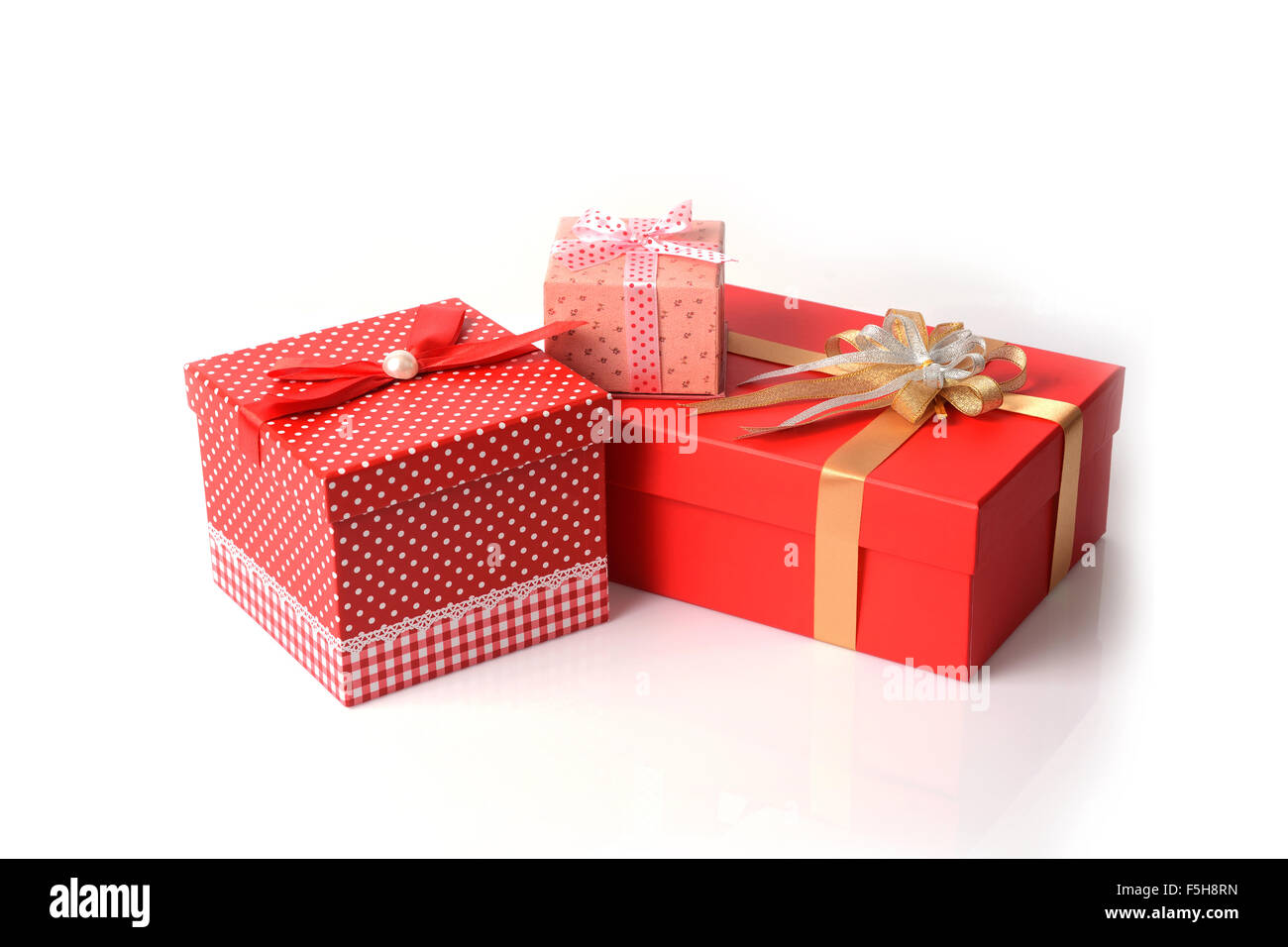 Three gift boxes, various size and design, on white background Stock ...