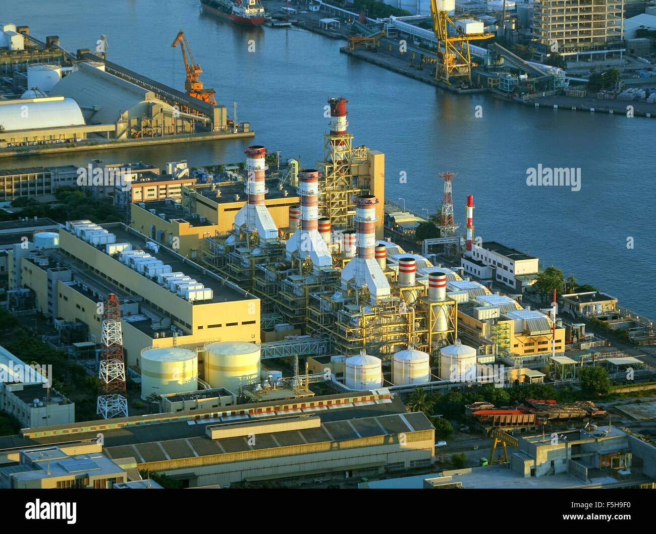 A large factory and industrial complex situated on the waterfront by ...