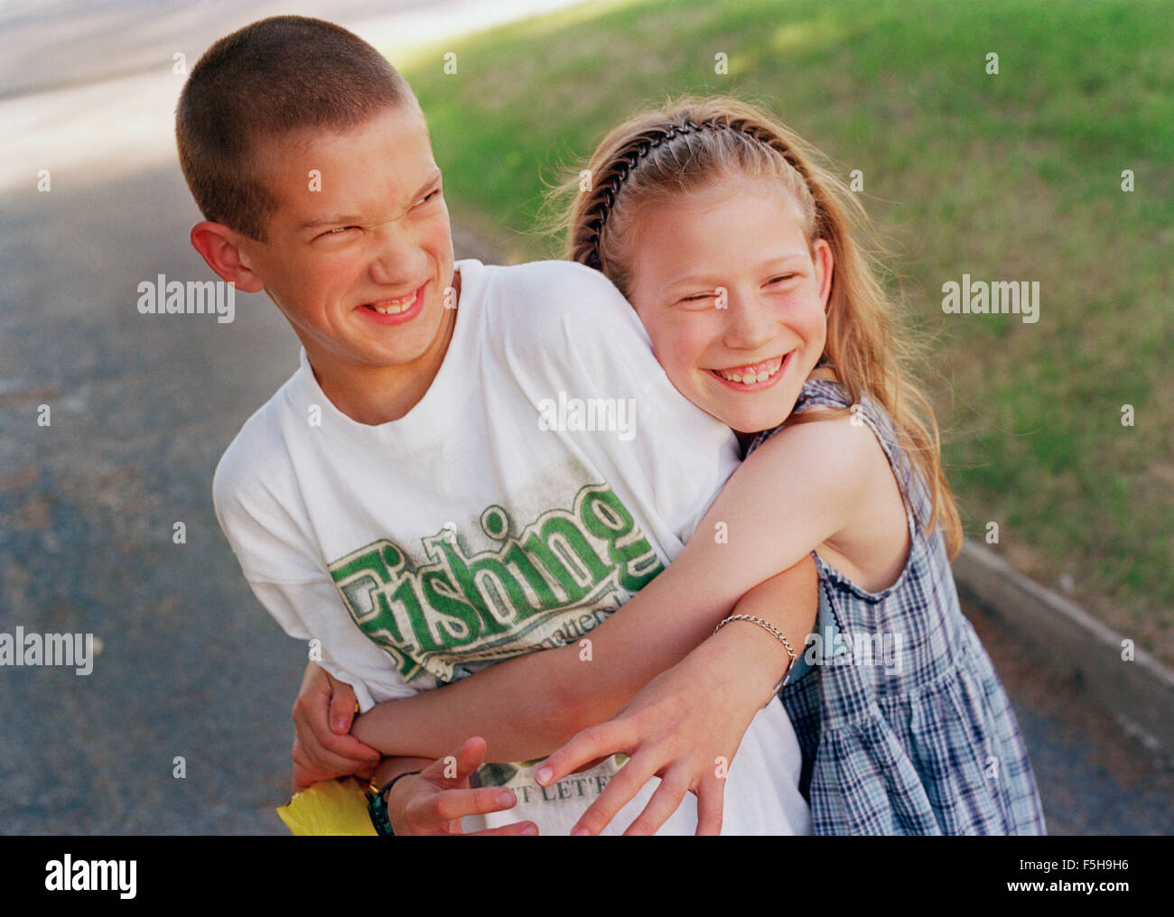 Siblings playing together Stock Photo - Alamy