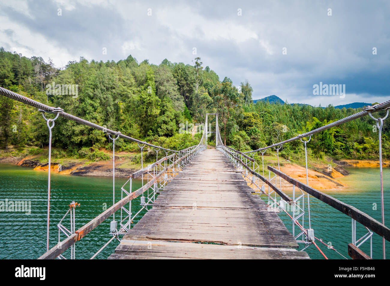 Wooden suspension bridge in Guatape, Colombia Stock Photo - Alamy