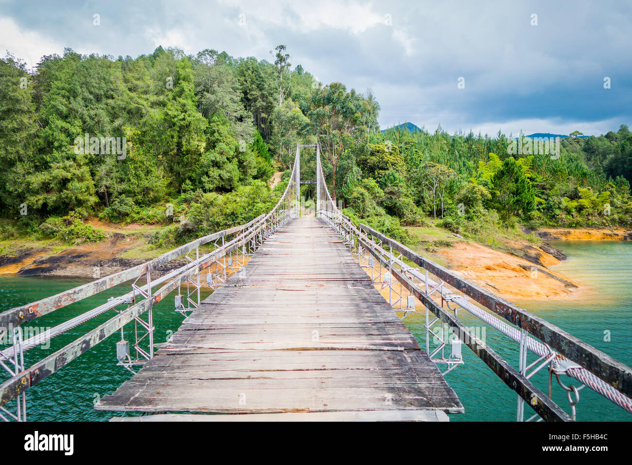 Wooden suspension bridge in Guatape, Colombia Stock Photo - Alamy