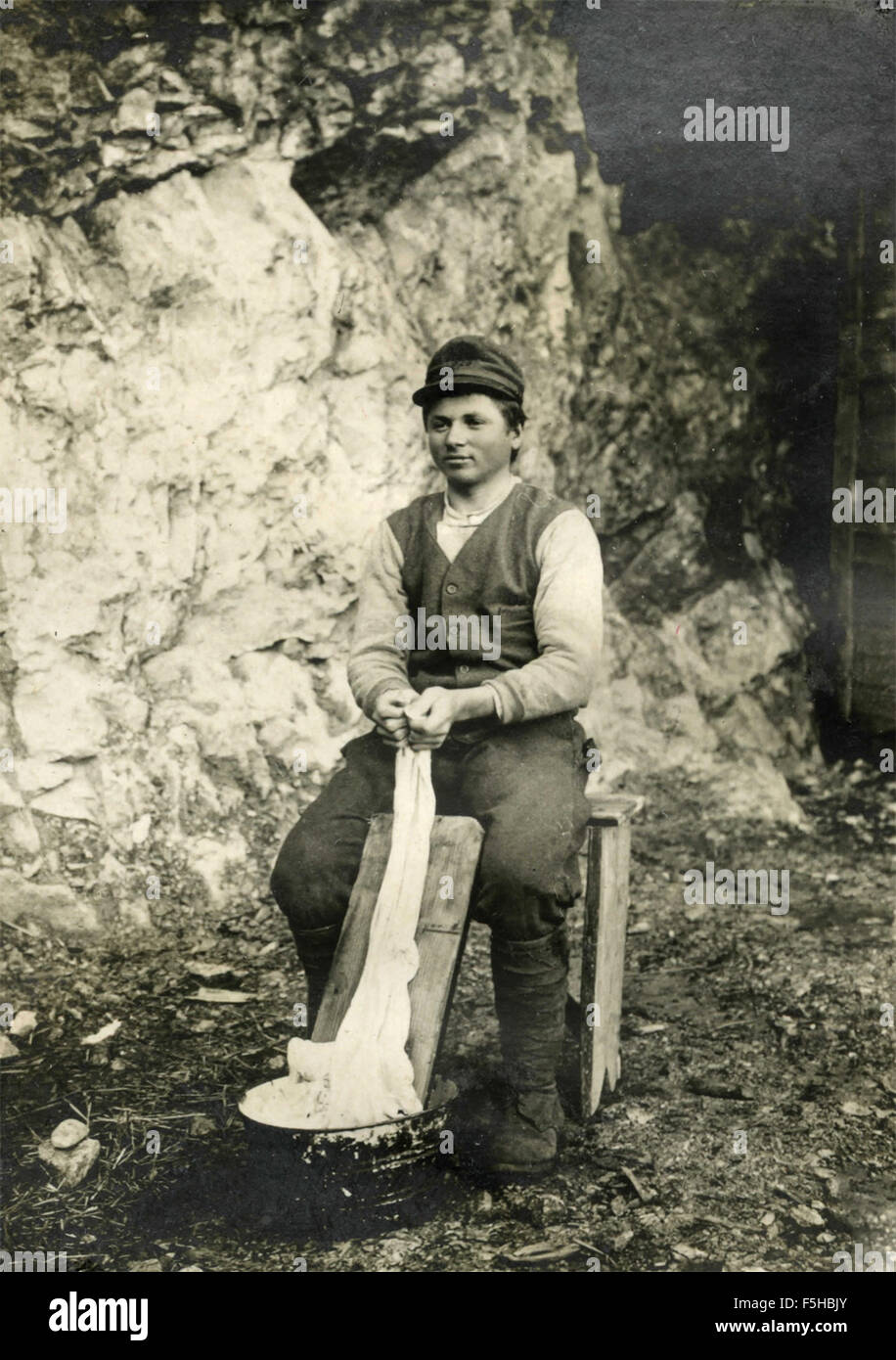 Soldier intent on doing laundry, Italy Stock Photo - Alamy