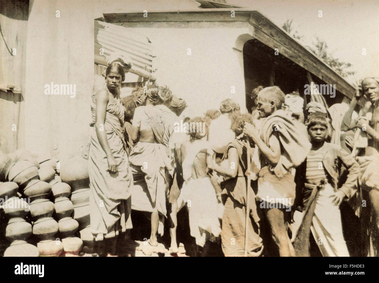 Group of Indians in a row at a shop, India Stock Photo - Alamy