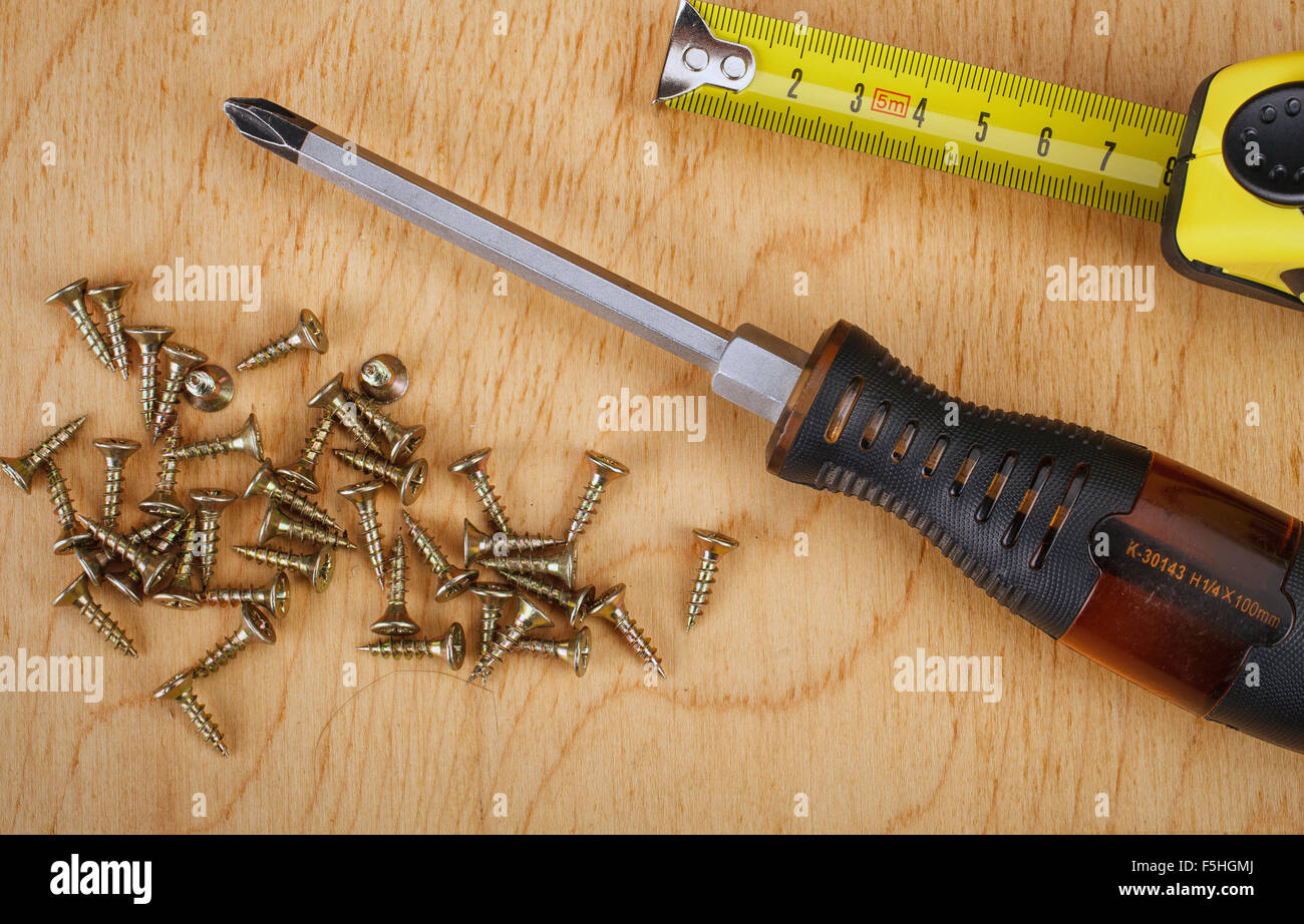 Screws and screwdriver Stock Photo - Alamy